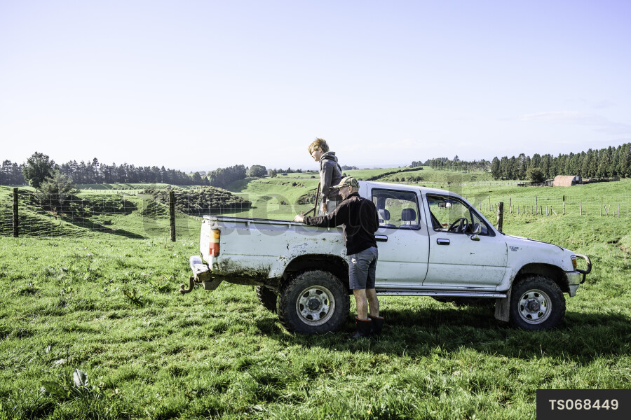 Young Boy on back of Ute by Jay Drew - Truestock