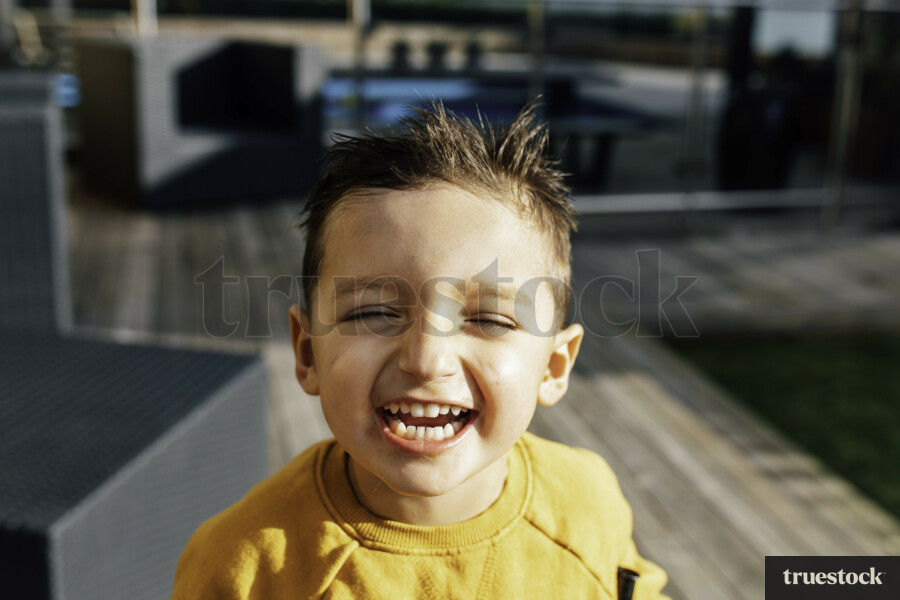 Young boy smiling by Northland Photography - Laura Evans - Truestock