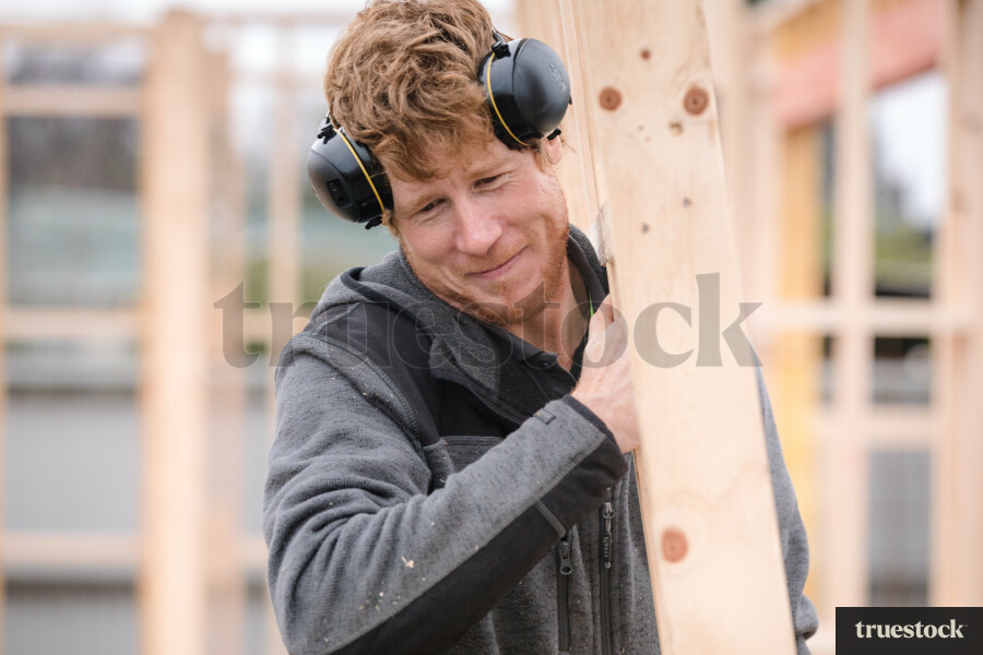 Builder onsite working on a new suburban house build by Kathryn Taylor ...