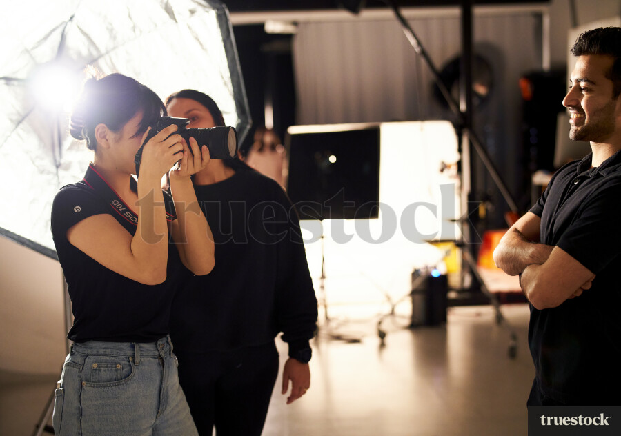 Students Taking Pictures of Each Other by Spid Pye - Truestock