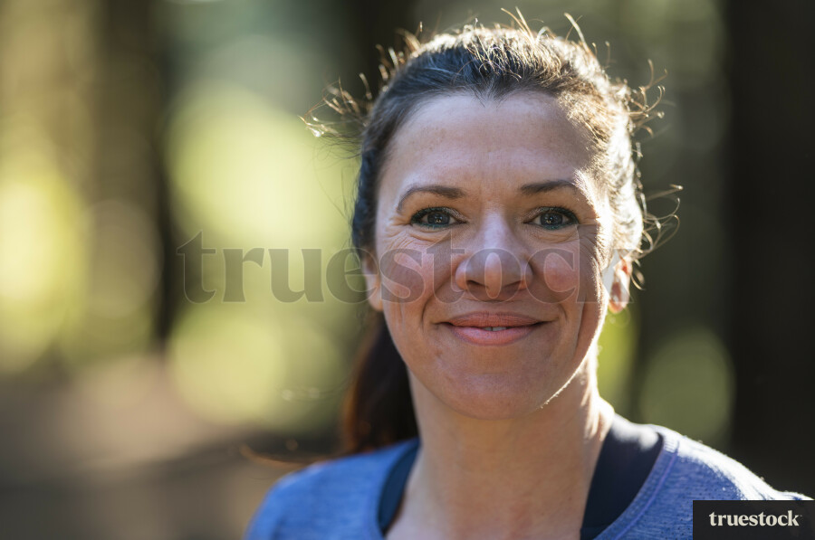 Woman doing exercise by James Stonley - Truestock