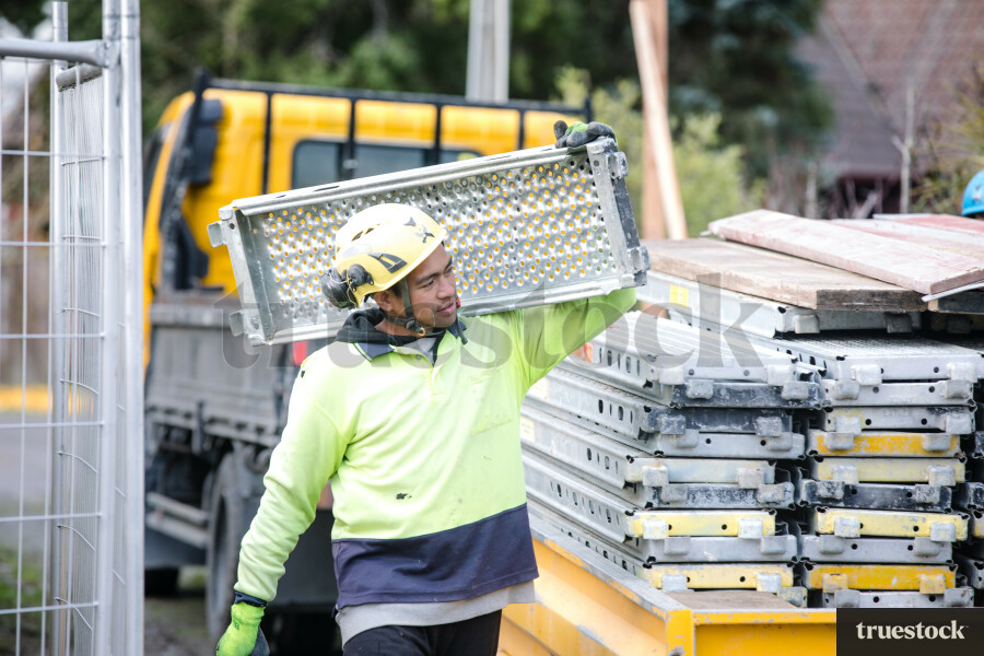 Builder onsite working on a new suburban house build by Kathryn Taylor ...