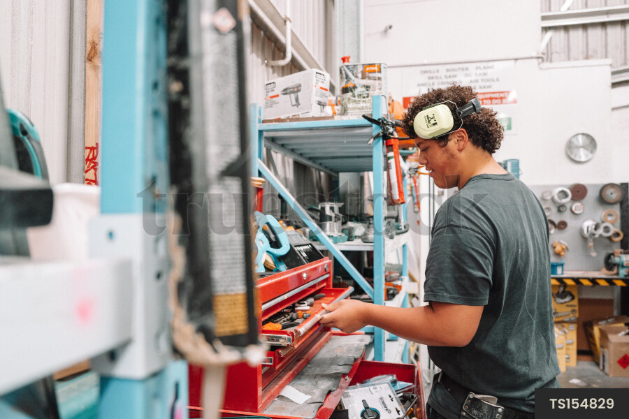 Workers Grabbing Tools by Ngahuia Ormsby - Truestock