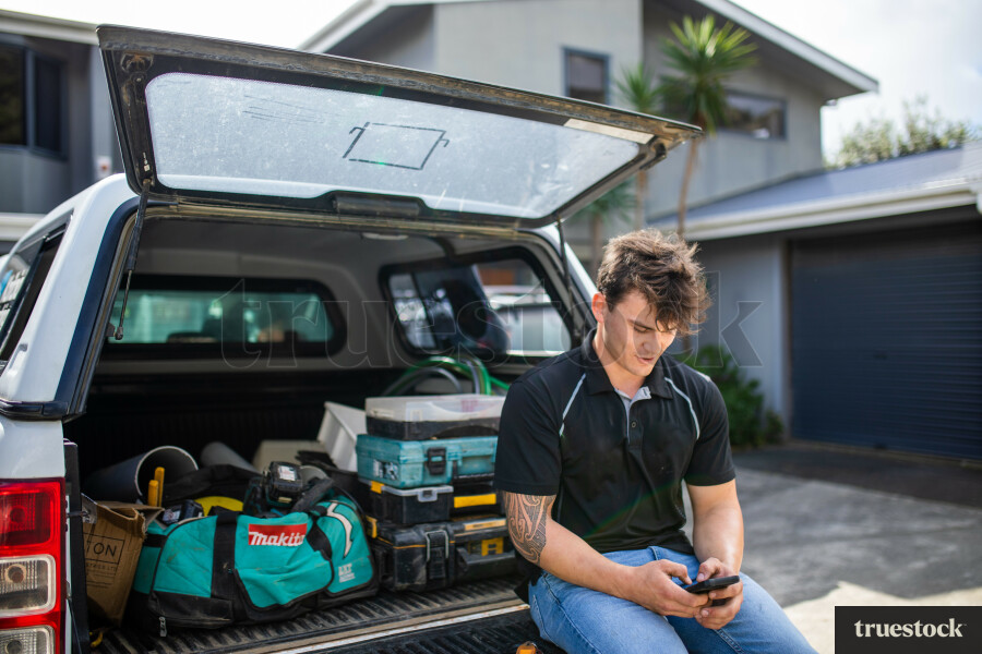 Tradie using Phone in the Boot of Truck by Northland Photography ...