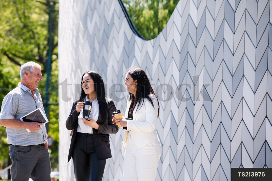 TS213976 Corporate Workers Walking after Work by Kathryn Taylor - Truestock