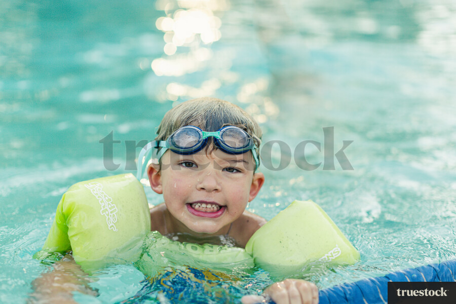 Boy in Pool by David Marano - Truestock