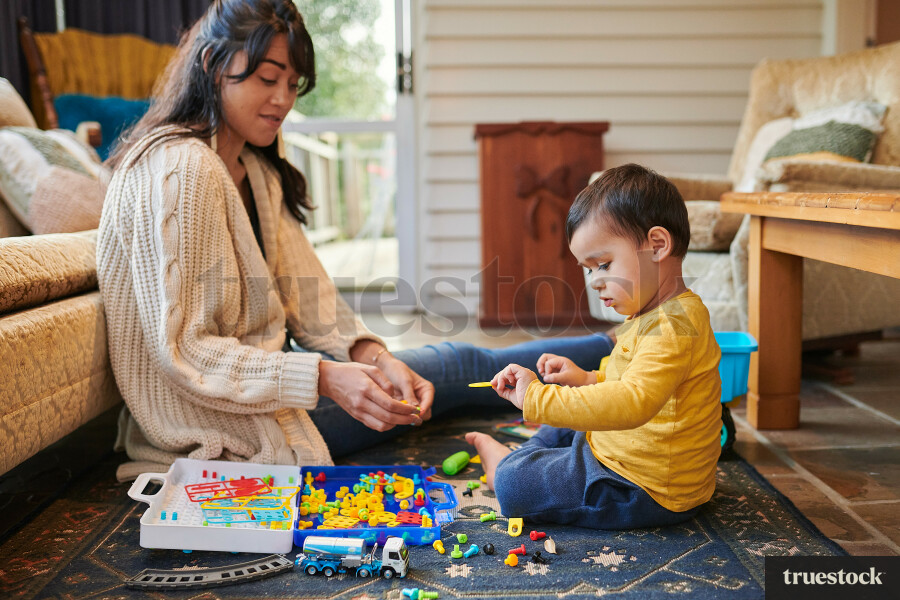 Mum and son play with toys by Josh Griggs - Truestock