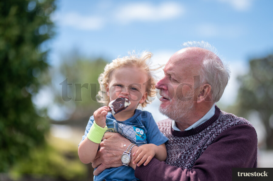 Grandfather and Grandson eating an Ice Cream by James Stonley - Truestock