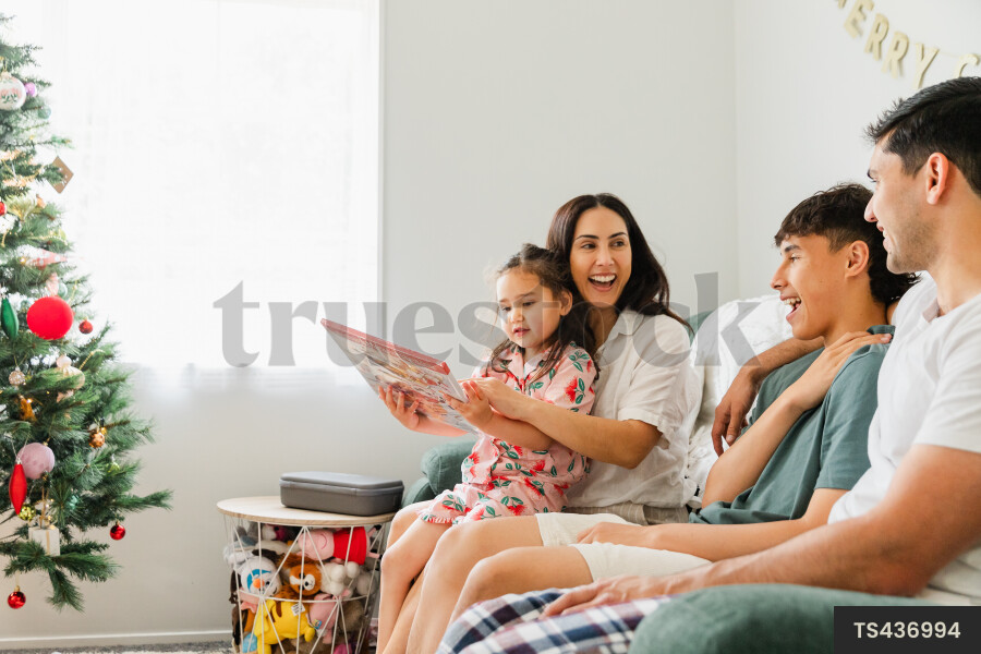 Family on Couch by Irene Maton - Truestock