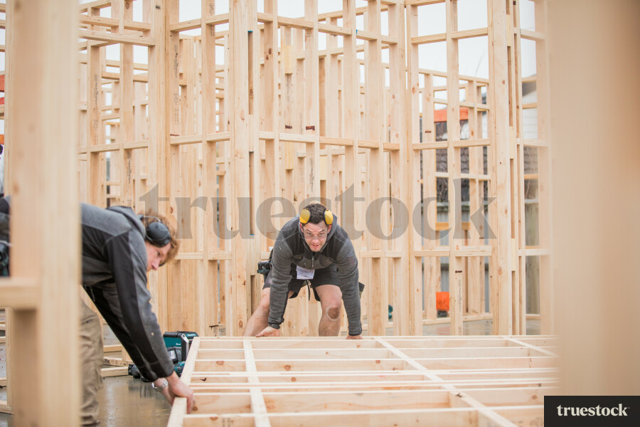 Builder onsite working on a new suburban house build by Kathryn Taylor ...