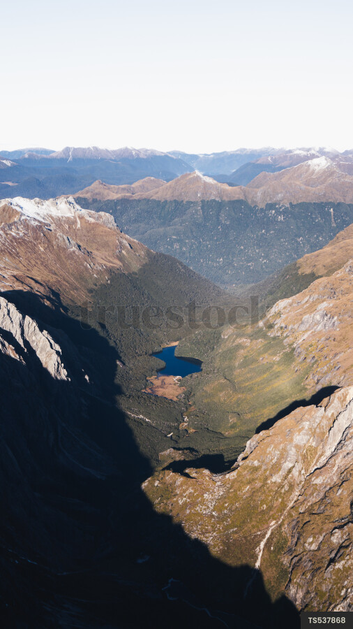 Aerial view of Fiordland National Park by Oscar Hetherington - Truestock