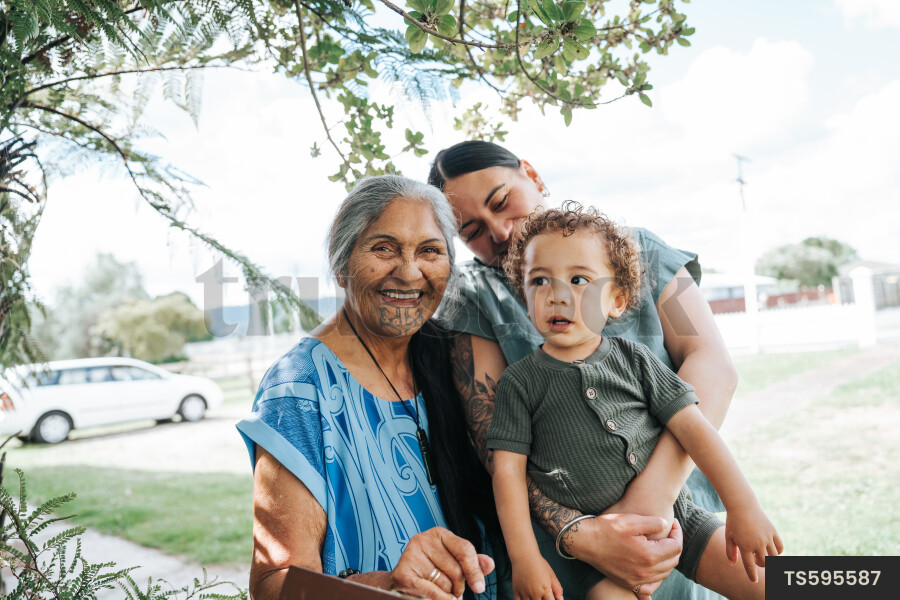 Family in Garden by Ngahuia Ormsby - Truestock