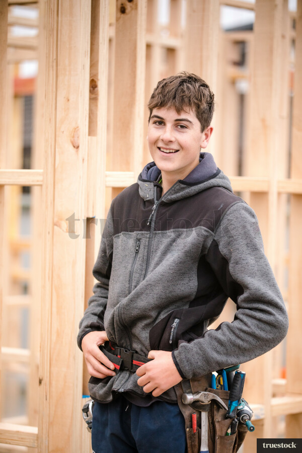 Builder onsite working on a new suburban house build by Kathryn Taylor ...