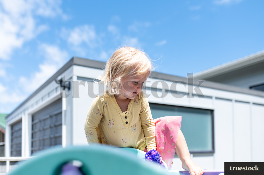 Young Girl on Playset by James Stonley - Truestock