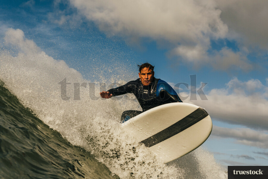 Surfing in Te Awanga by Michael Farr - Truestock
