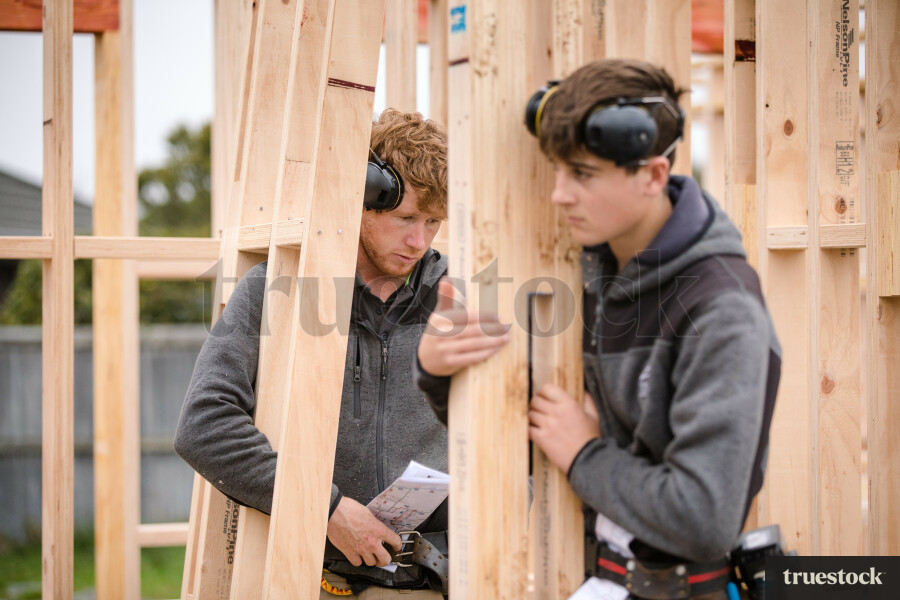 Builder onsite working on a new suburban house build by Kathryn Taylor ...