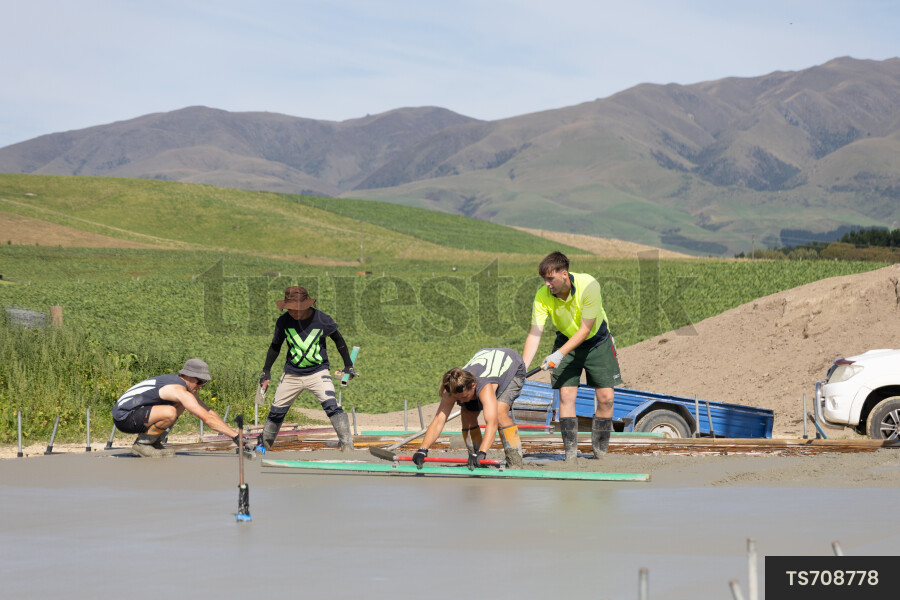 Construction workers with tool by concrete foundation by Bev Bell ...
