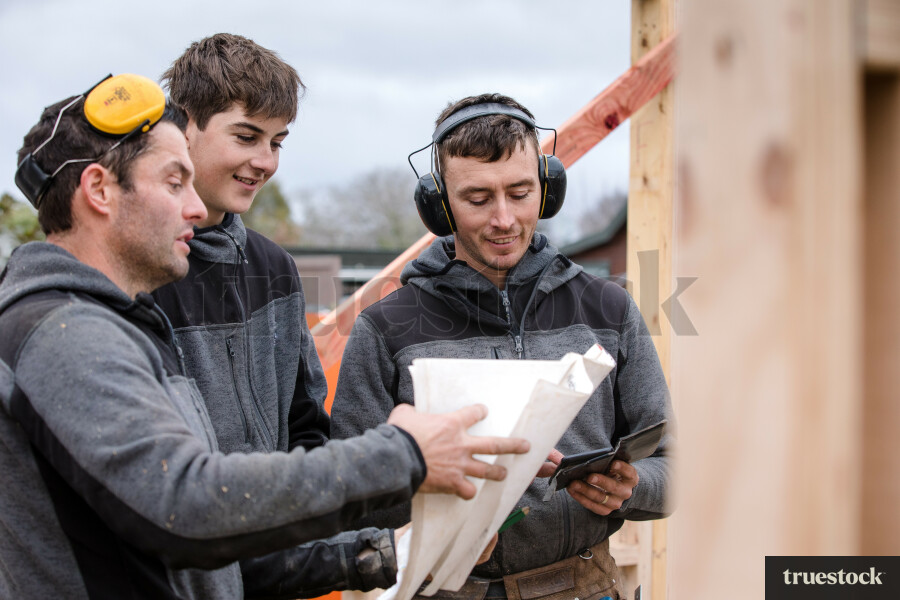 Builder onsite working on a new suburban house build by Kathryn Taylor ...