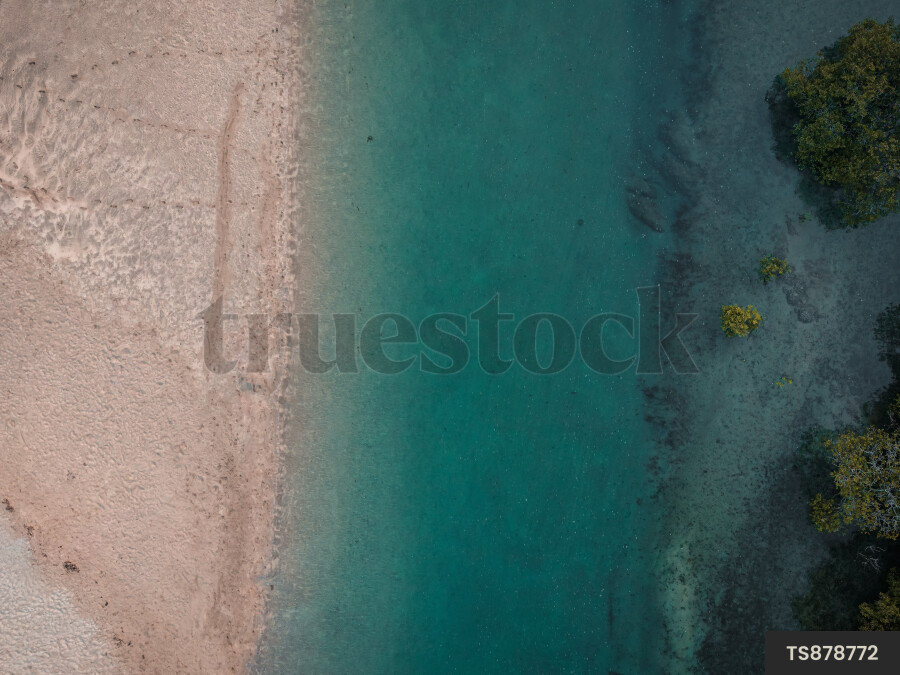 TS878772 Aerial view of turquoise estuary by Rowan Freeman - Truestock