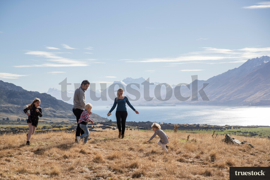 Family Exploring Queenstown by Vaughan Brookfield - Truestock