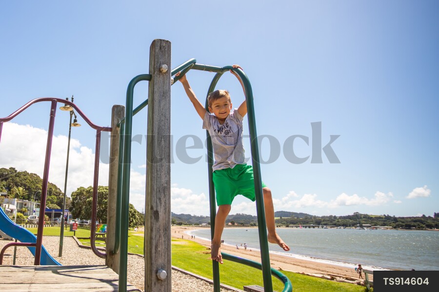Young Boy on Playground by Northland Photography - Laura Evans - Truestock
